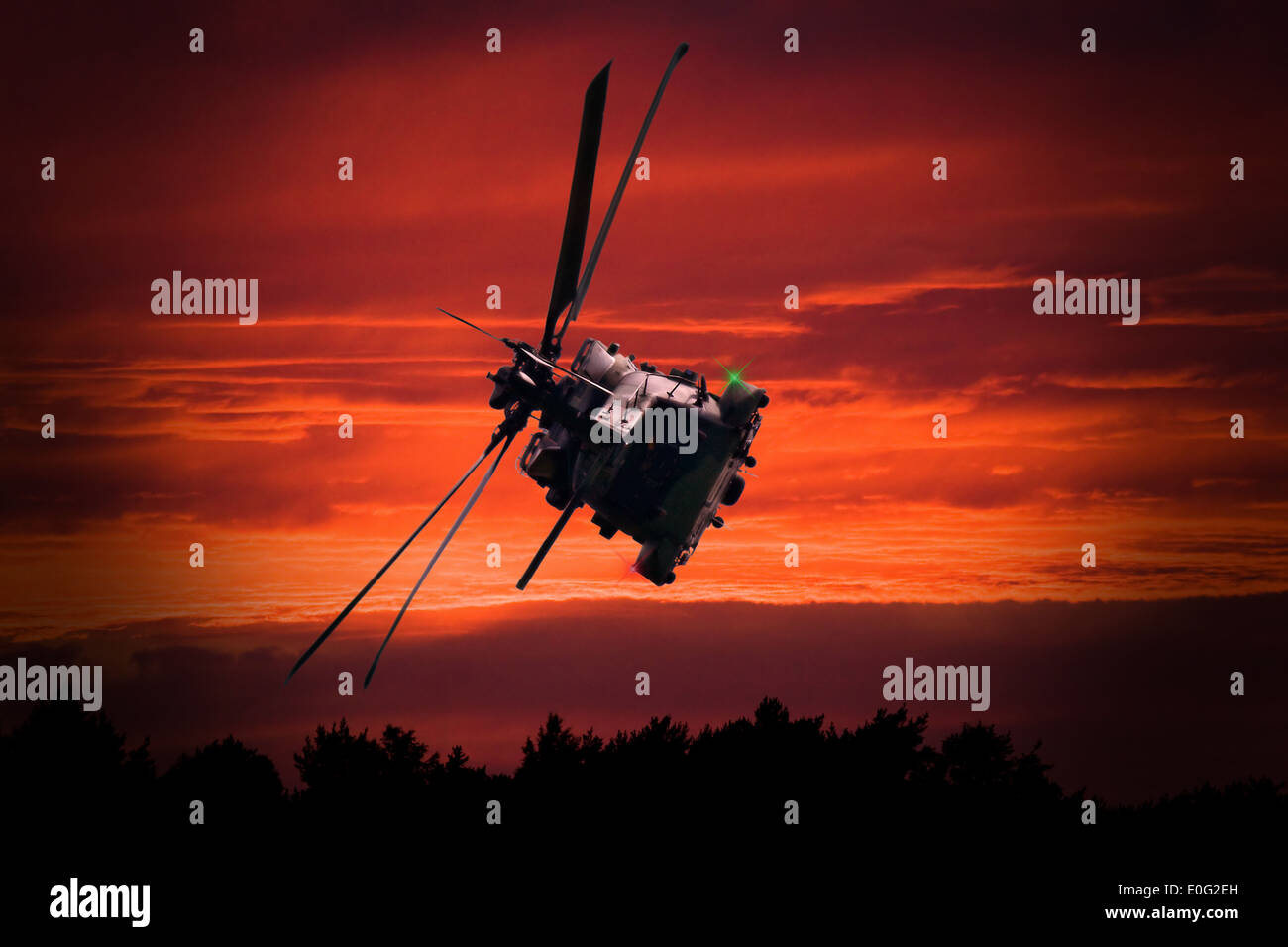 Helicopter at sunset Stock Photo - Alamy