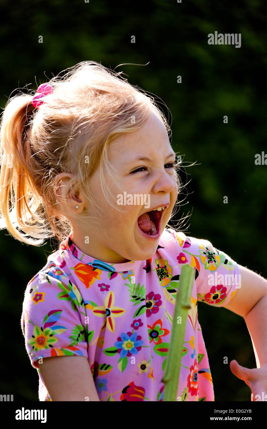 Small child roars with laughter and decently, Kleines Kind lacht ...