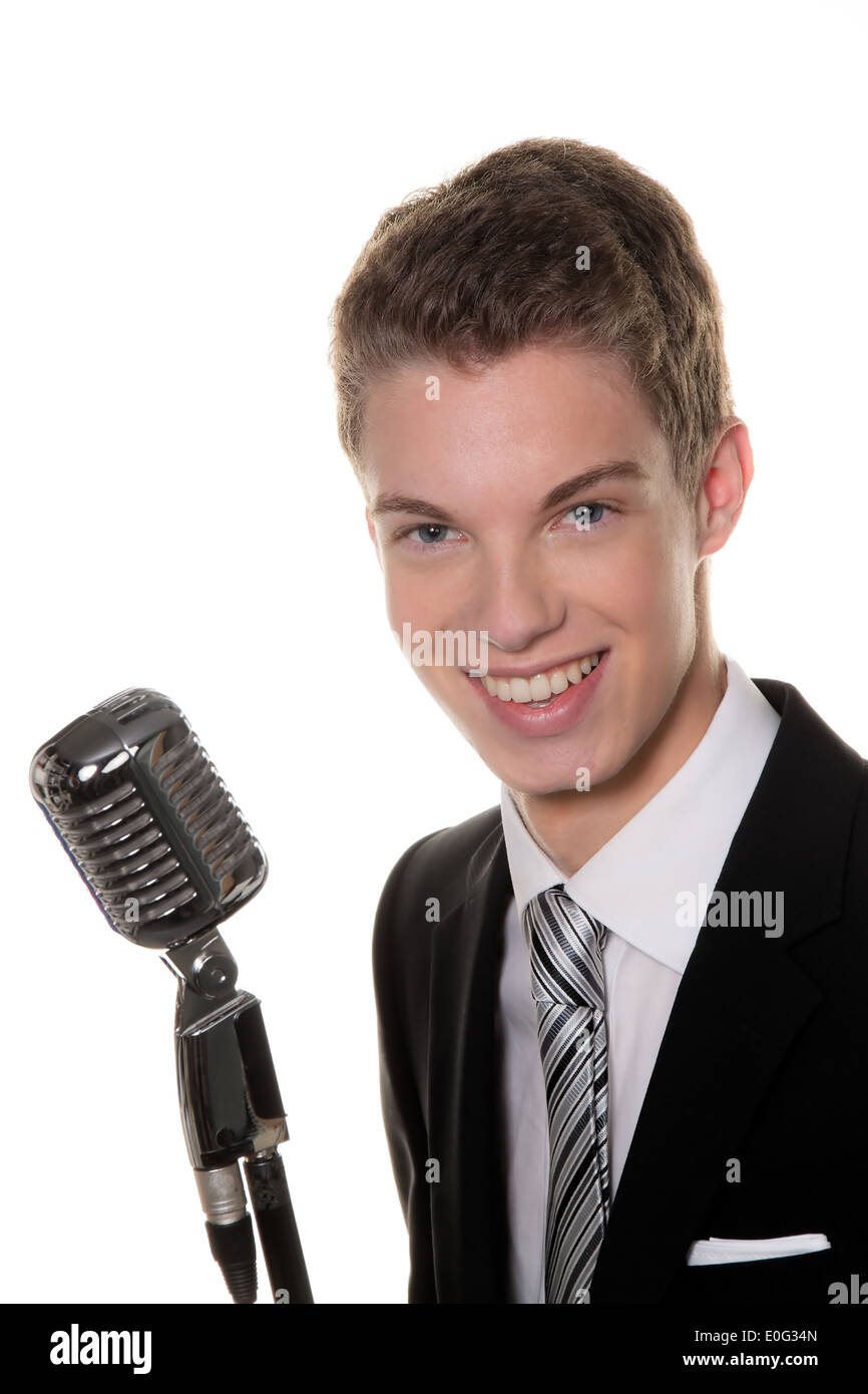 A young singer with Retro microphone sings karaoke, Ein junger Saenger ...