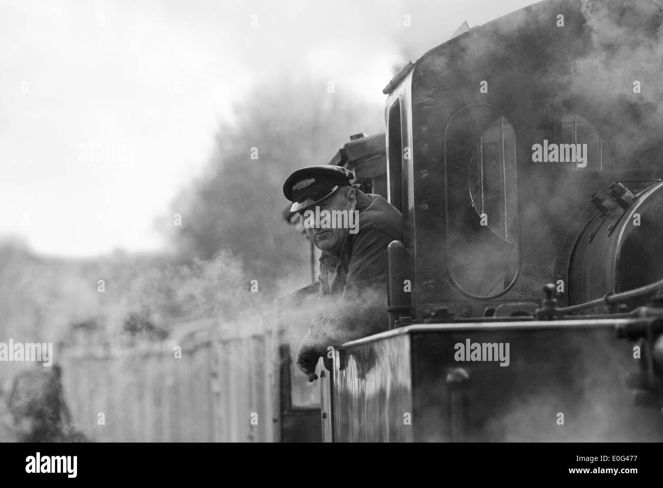 A steam engine driver looking out of his engine on the Great Central ...