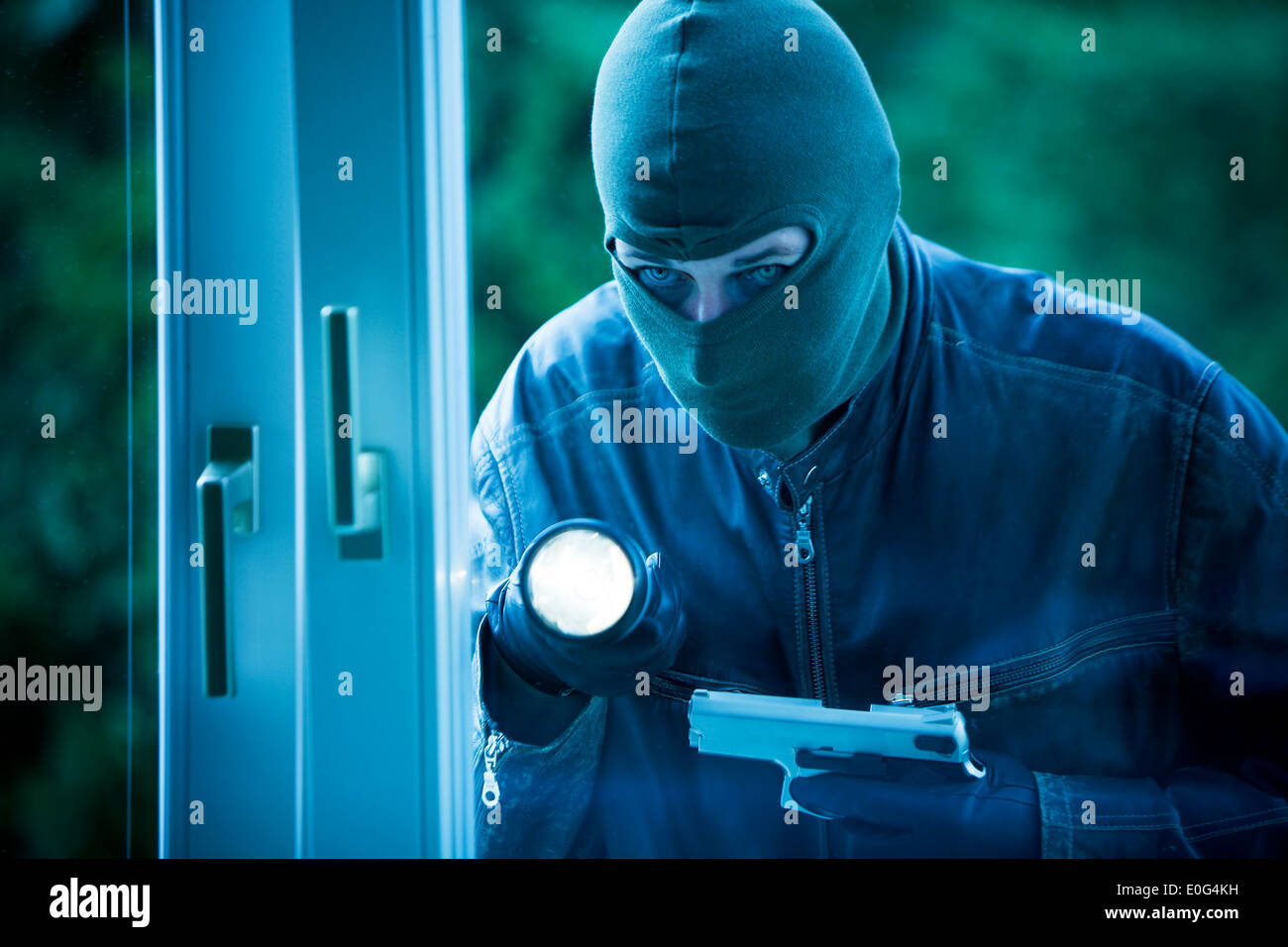 Burglar at a window housebreaker burglary Stock Photo - Alamy