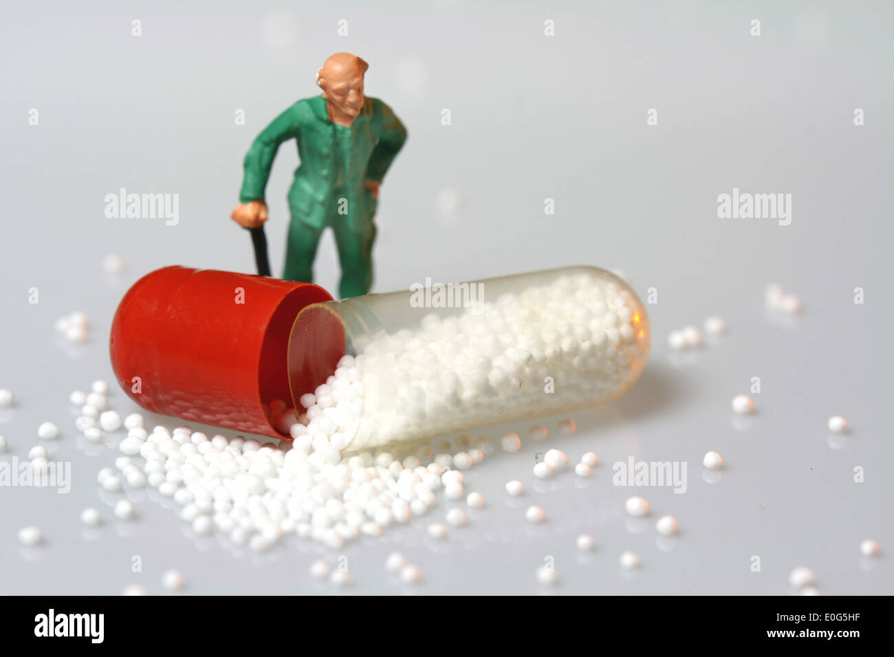 old Man standing medicine pill drugs symbolic Stock Photo - Alamy