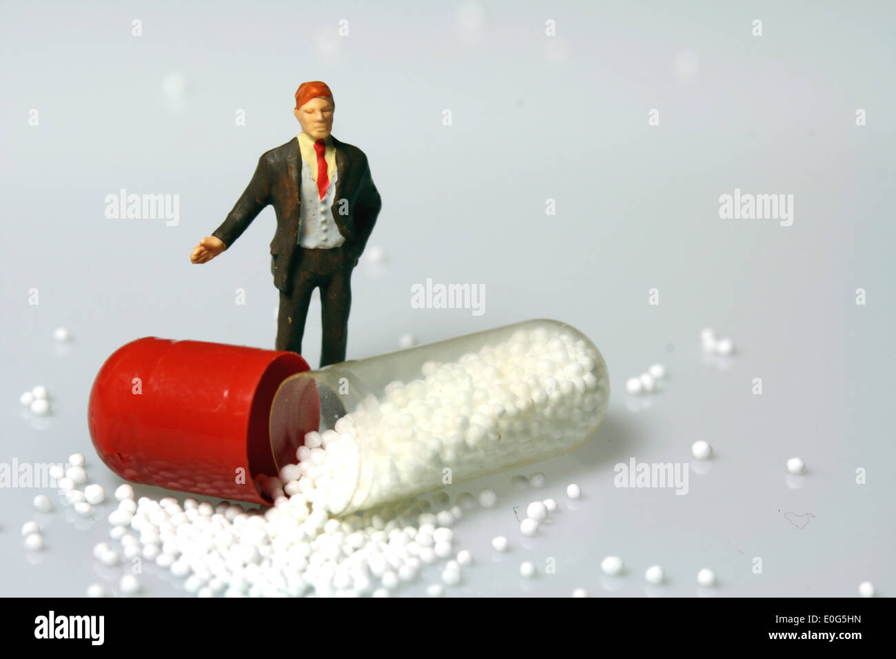 Man standing medicine pill drugs symbolic Stock Photo - Alamy