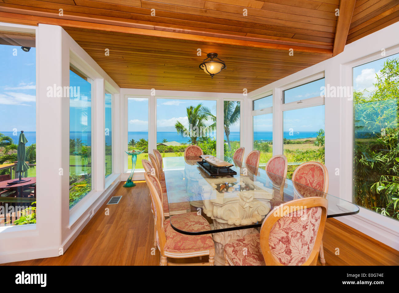 Dining Room with Large Windows and Hardwood Floor in Luxury Home Stock ...