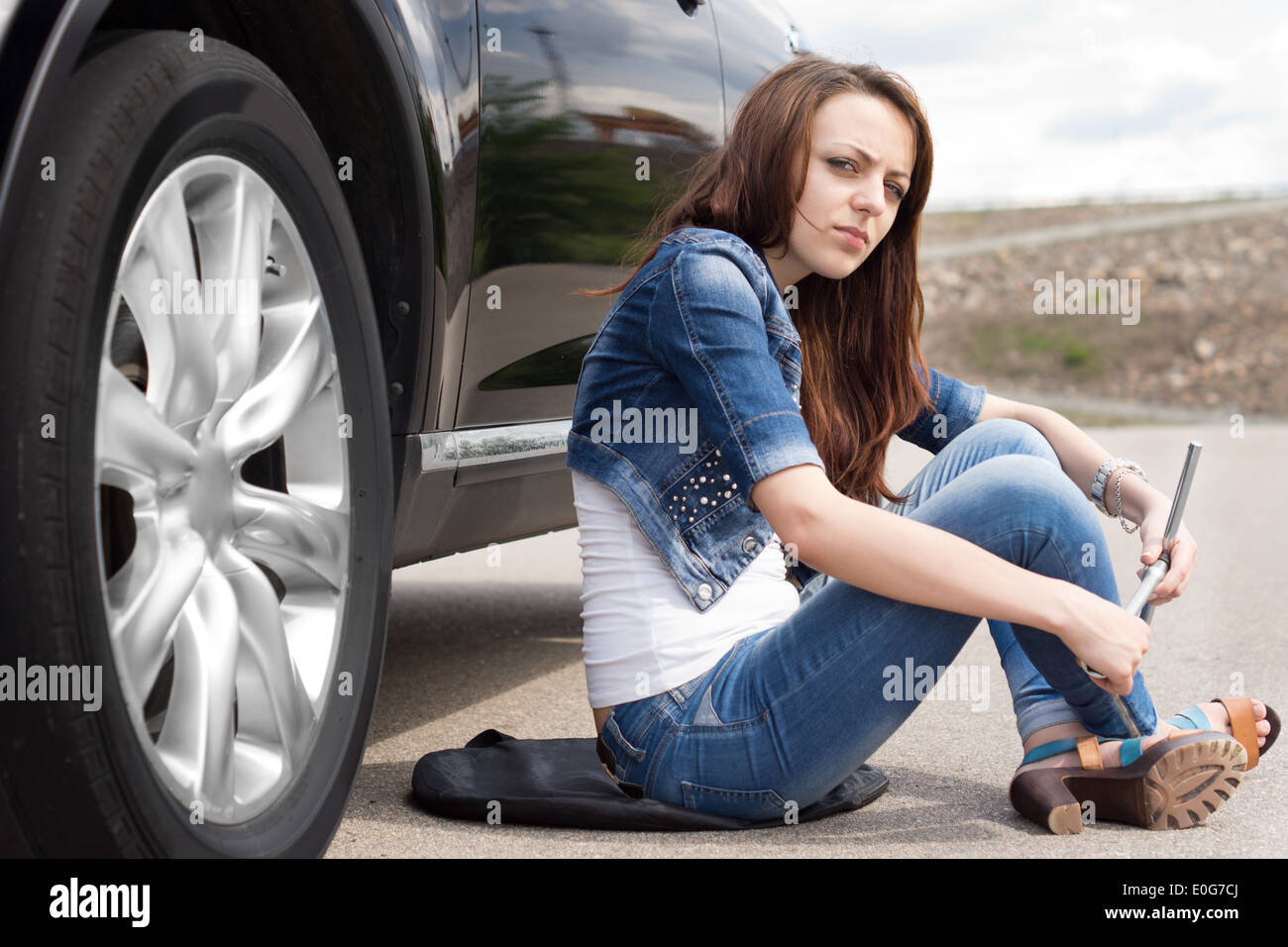 Female driver waiting for roadside assistance Stock Photo - Alamy