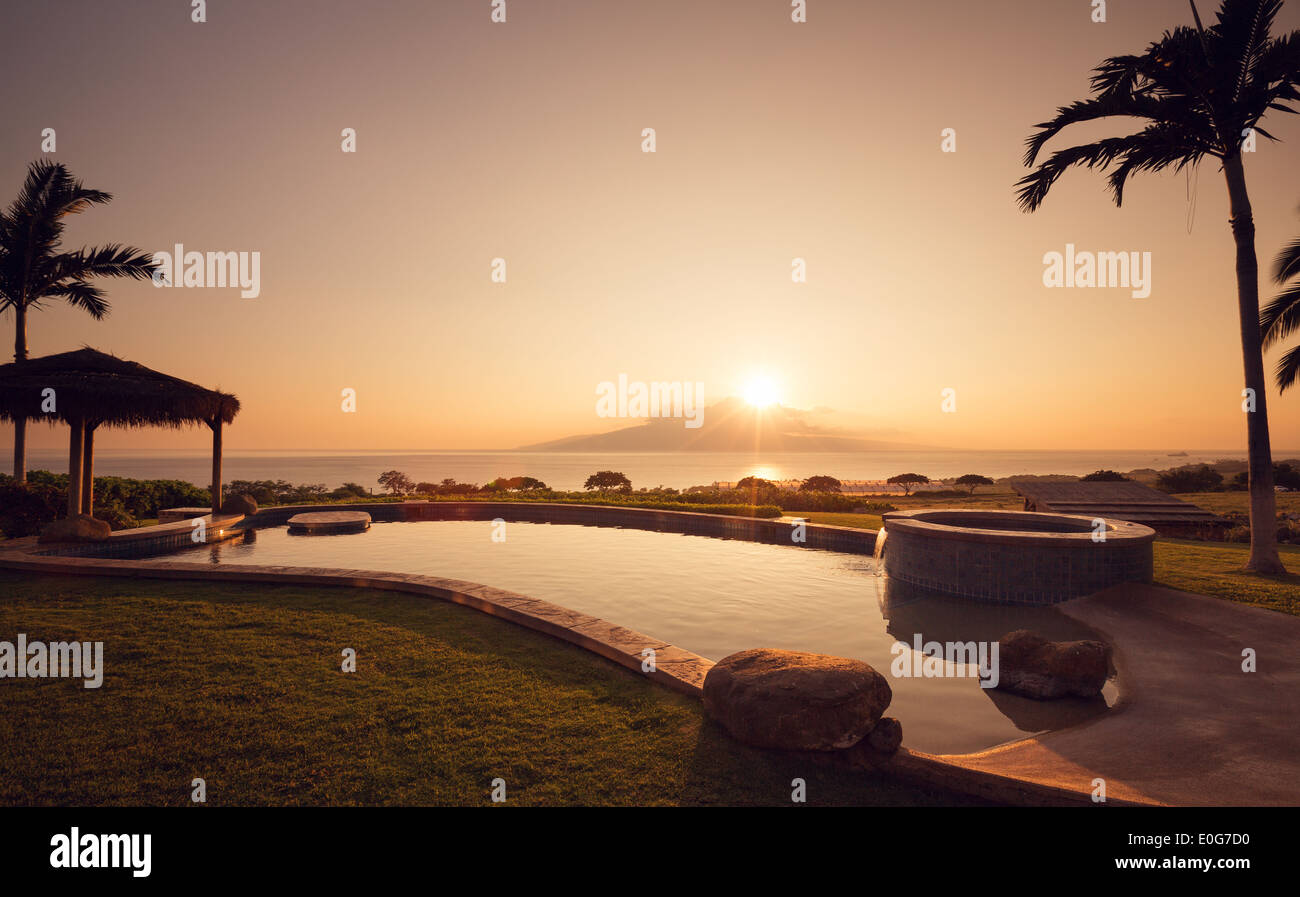 Luxury home with swimming pool at sunset Stock Photo - Alamy