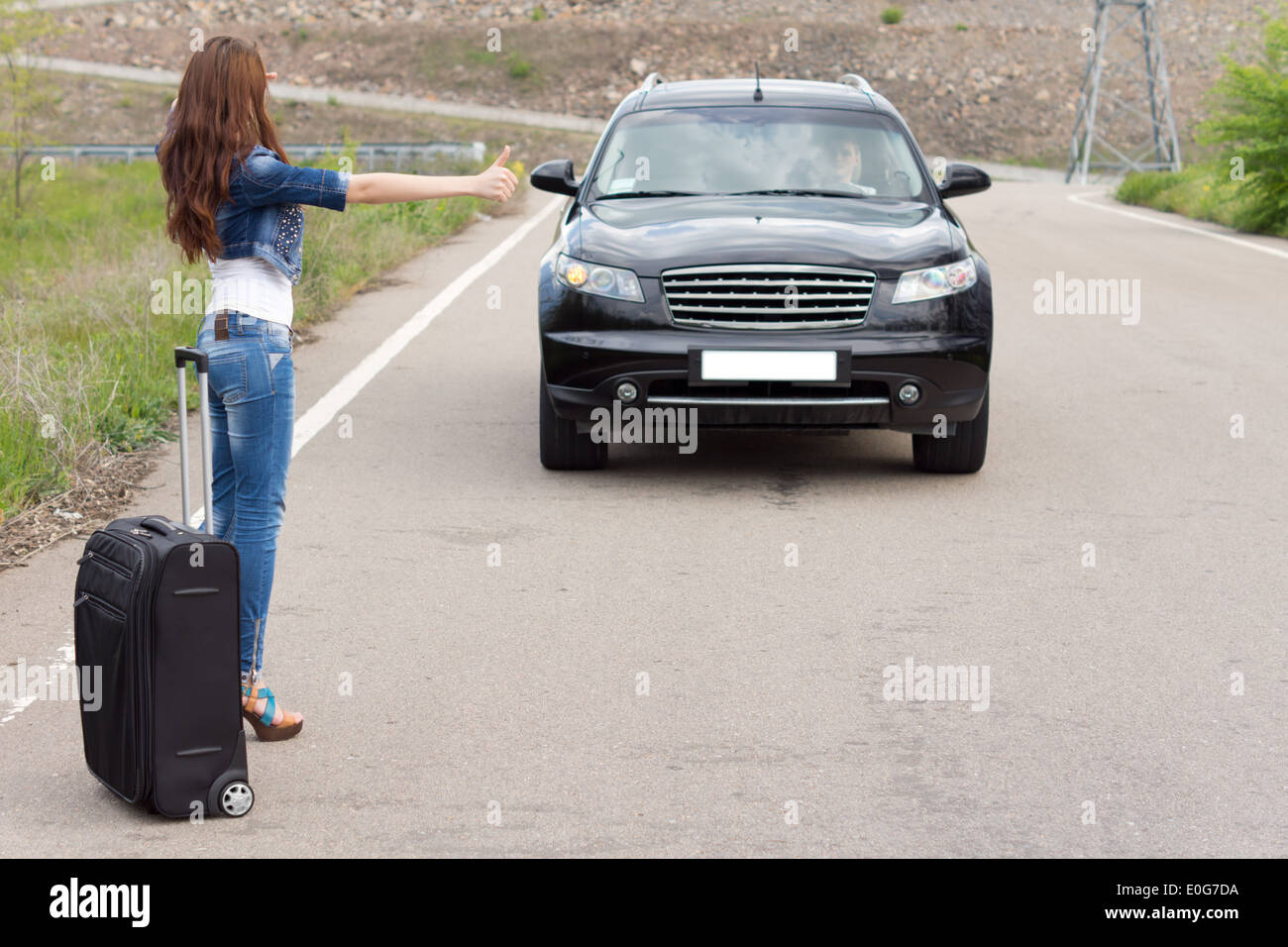 Stranded woman flagging down car hi-res stock photography and images ...