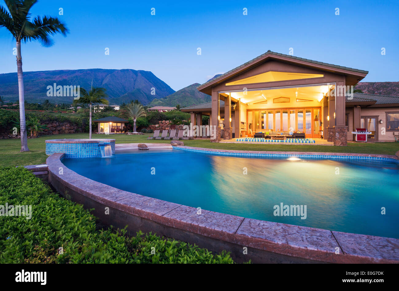 Luxury home with swimming pool at sunset Stock Photo - Alamy