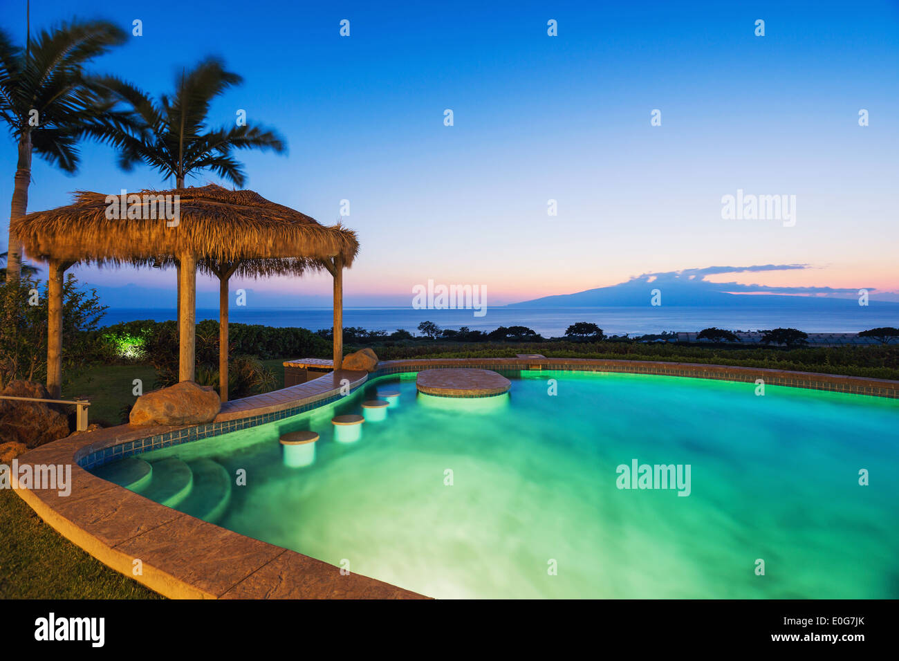 Luxury home with swimming pool at sunset Stock Photo - Alamy
