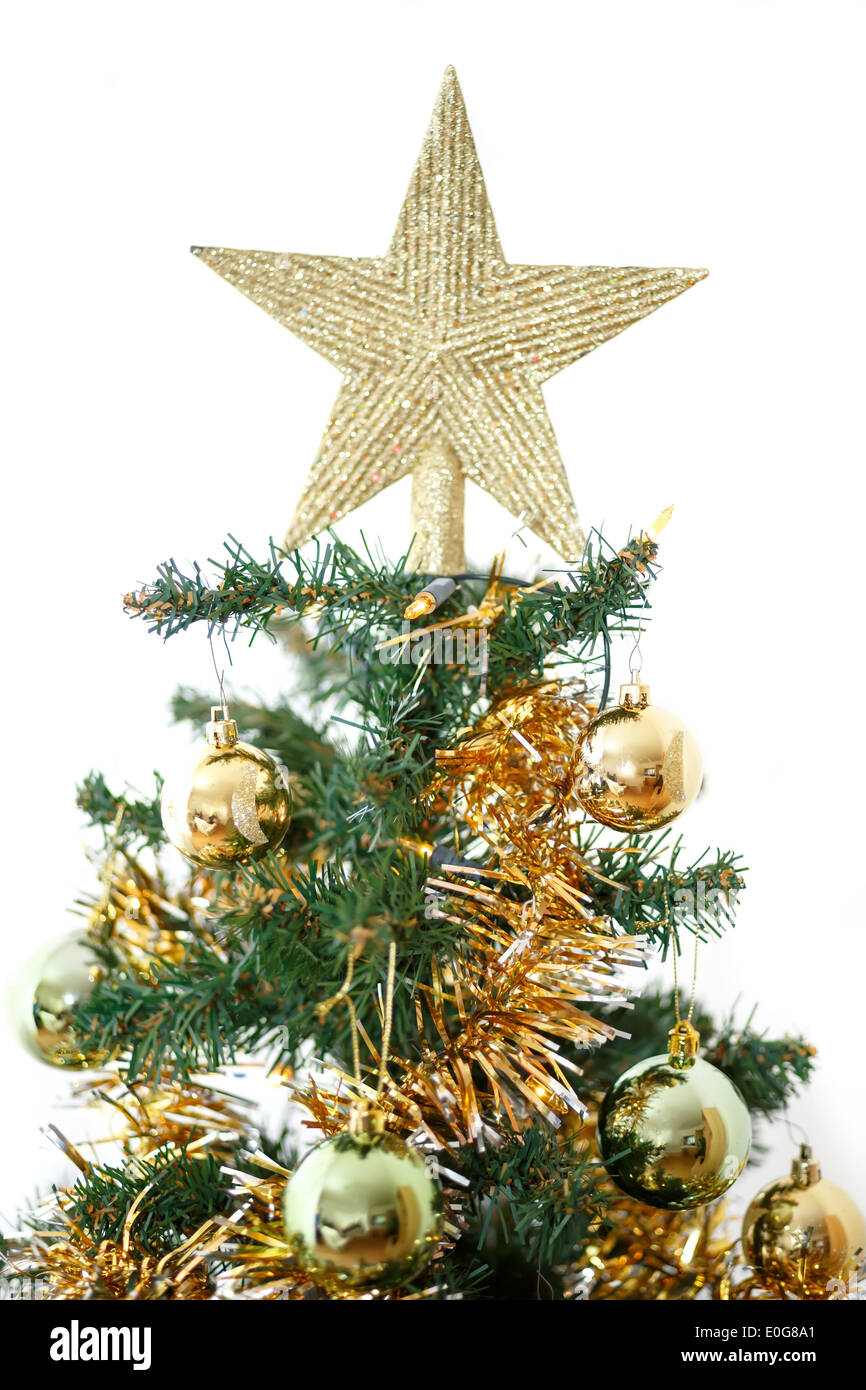 Decorated christmas tree with yellow and green balls on white ...