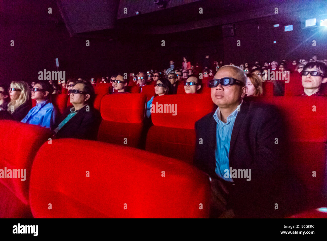 Paris, France, Members of the audience wear special glasses as they ...