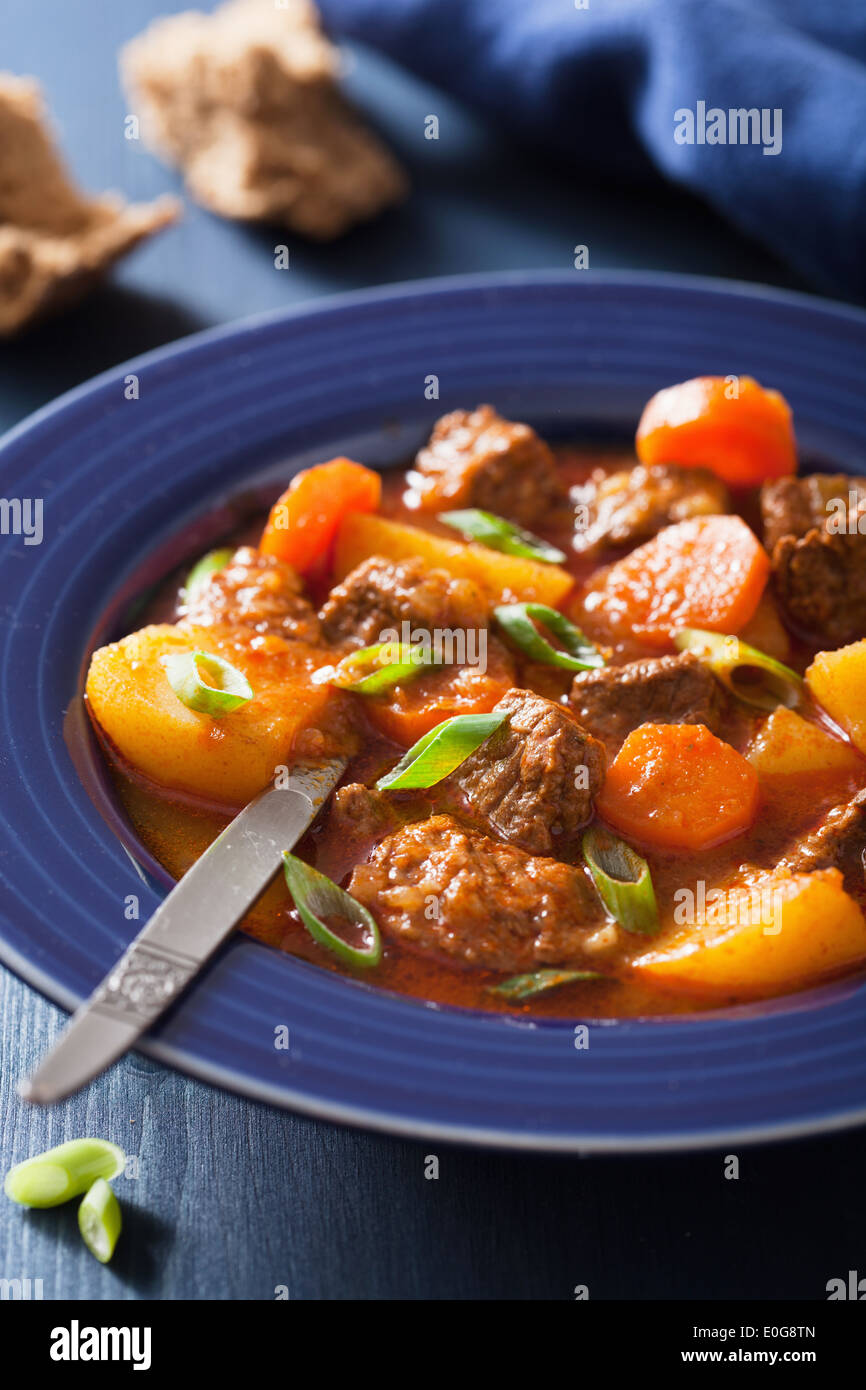 beef stew with potato and carrot in blue plate Stock Photo - Alamy