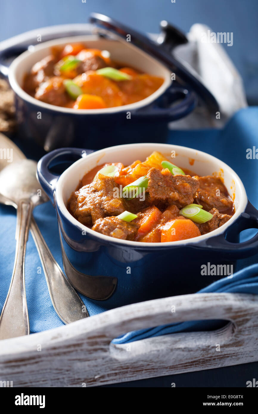 beef stew with potato and carrot in blue pots Stock Photo - Alamy