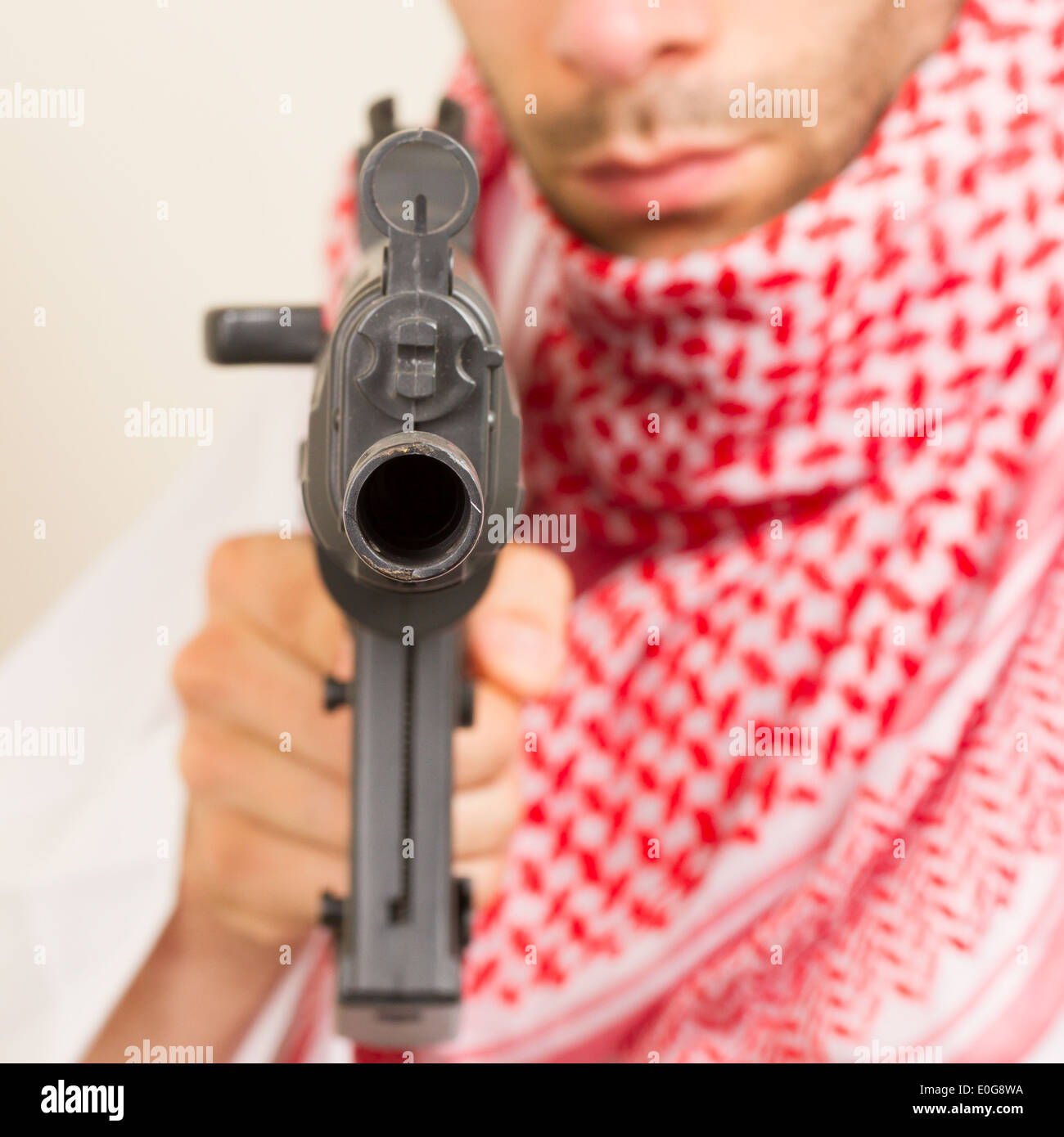 Arab adult with a machine gun, terrorist, isolated on white Stock Photo ...