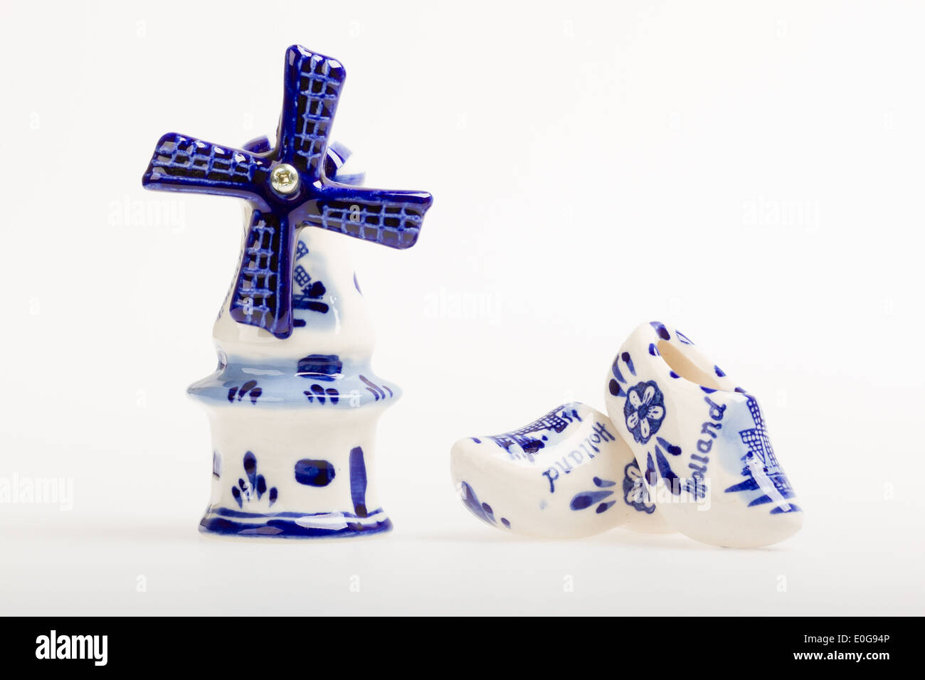 Dutch mini porcelain windmill and clogs on a white background Stock ...