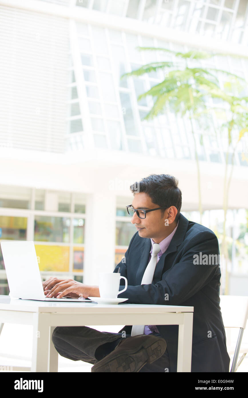 Indian Business man working on his laptop Stock Photo - Alamy