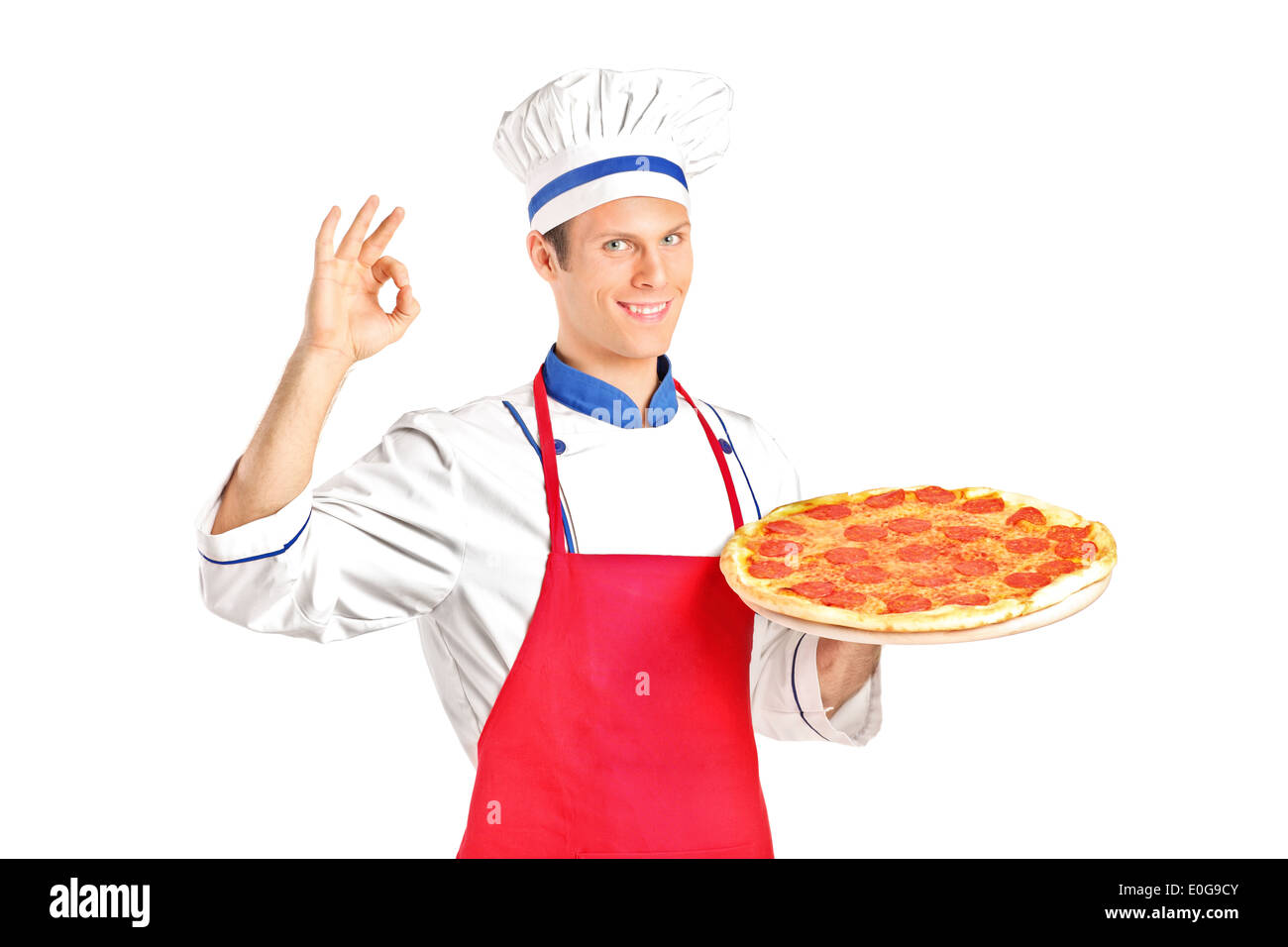 Male chef holding a pizza and gesturing with hand Stock Photo - Alamy