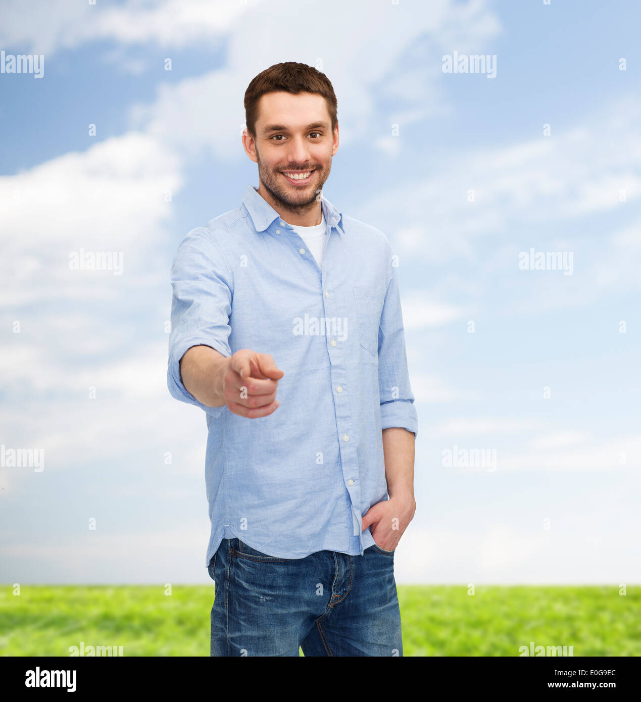 smiling man pointing finger at you Stock Photo - Alamy