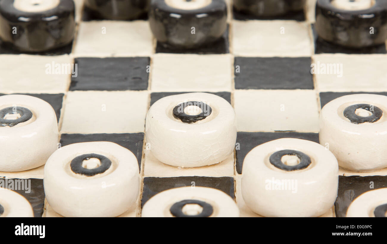 Very old game of checkers, pottery, isolated Stock Photo - Alamy