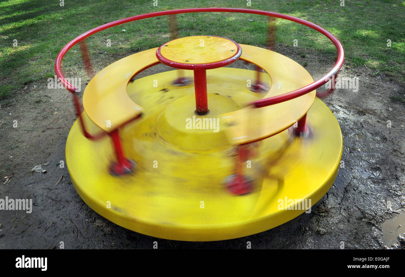 children carousel spinning round Stock Photo - Alamy