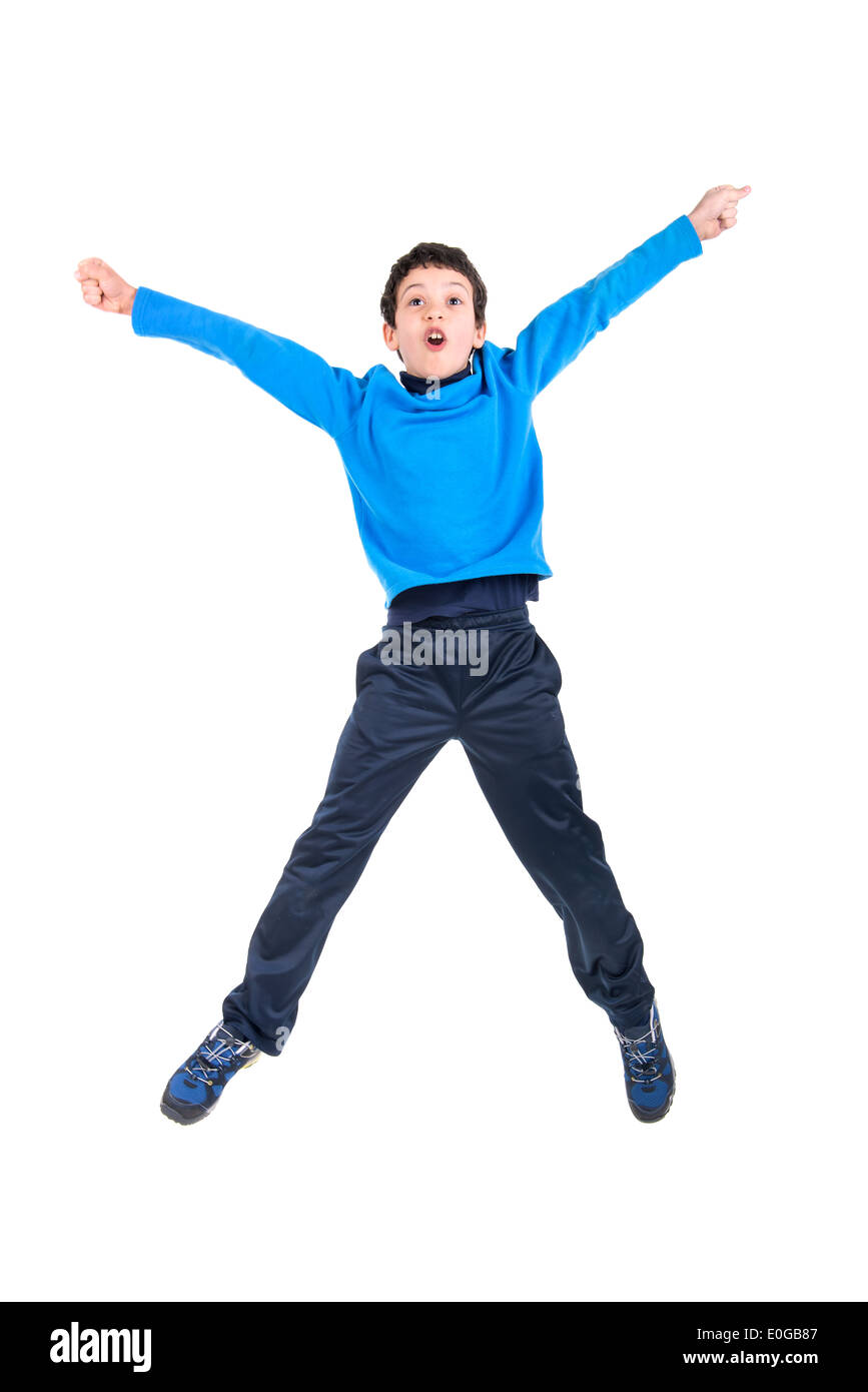 Young boy jumping isolated in white Stock Photo - Alamy