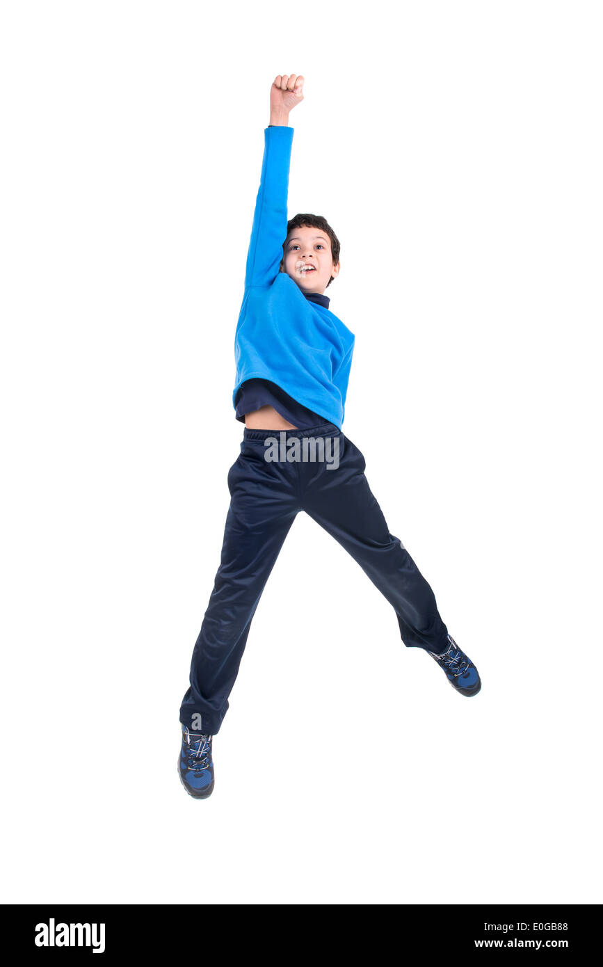 Young boy jumping isolated in white Stock Photo - Alamy