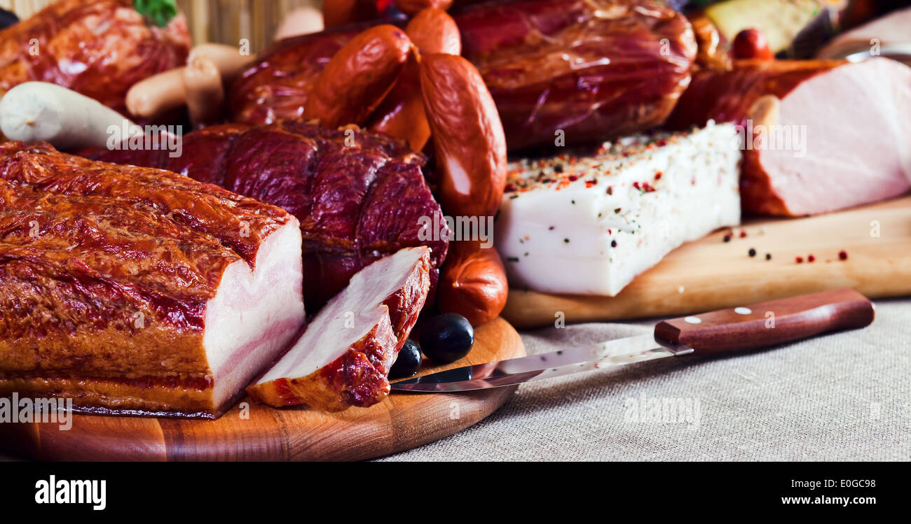 smoked meat and sausages on a linen cloth Stock Photo - Alamy