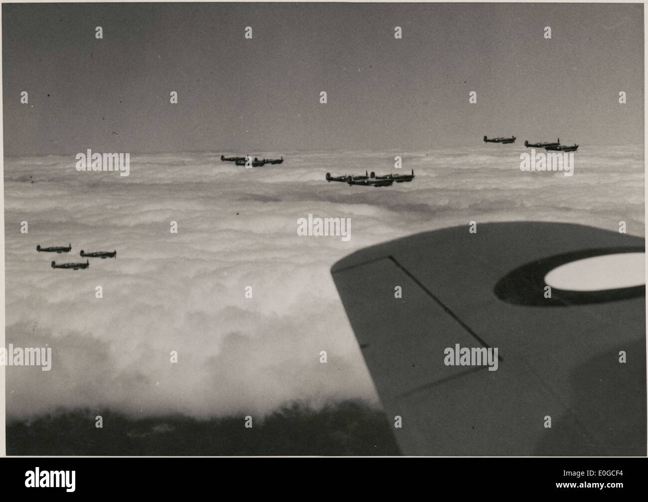 Spitfire kings flying high above the clouds alongside a Royal ...