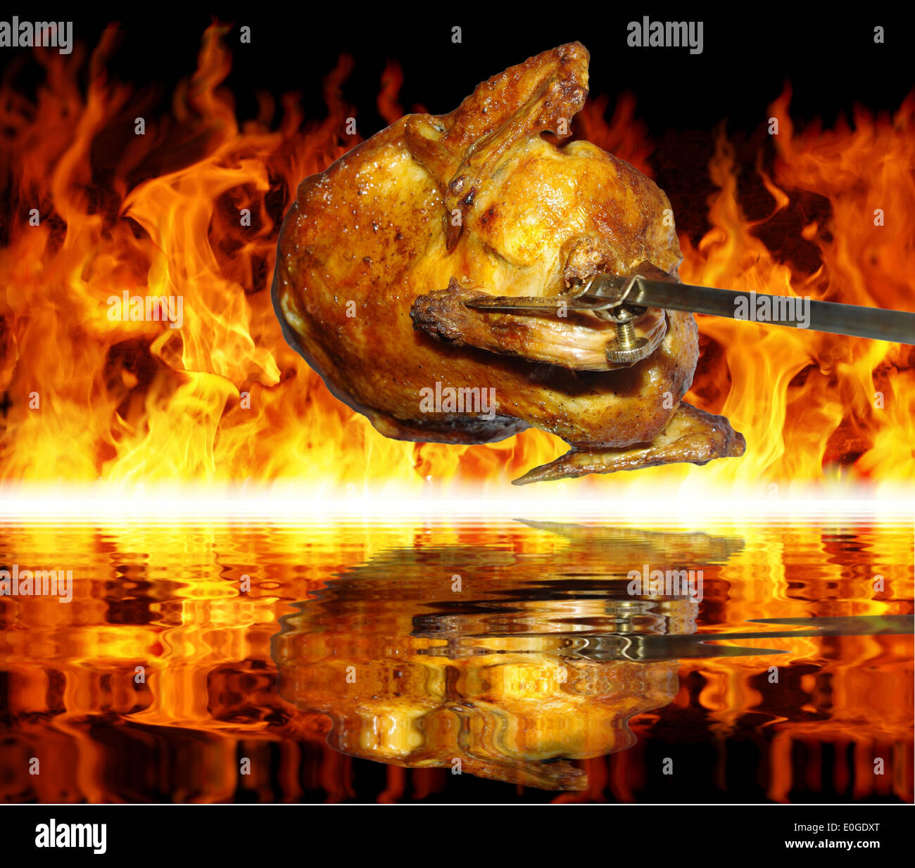 chicken on grill on background of flames Stock Photo - Alamy