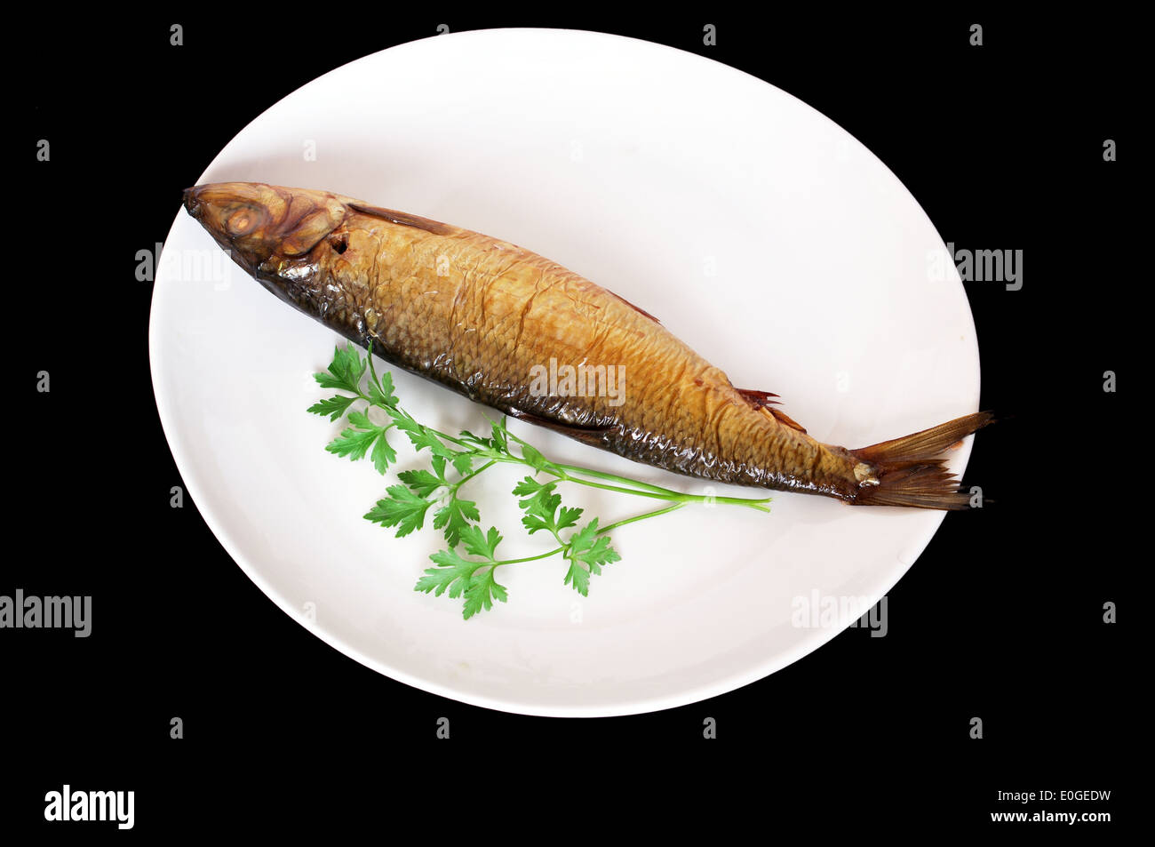 one smoked kipper on white plate Stock Photo - Alamy
