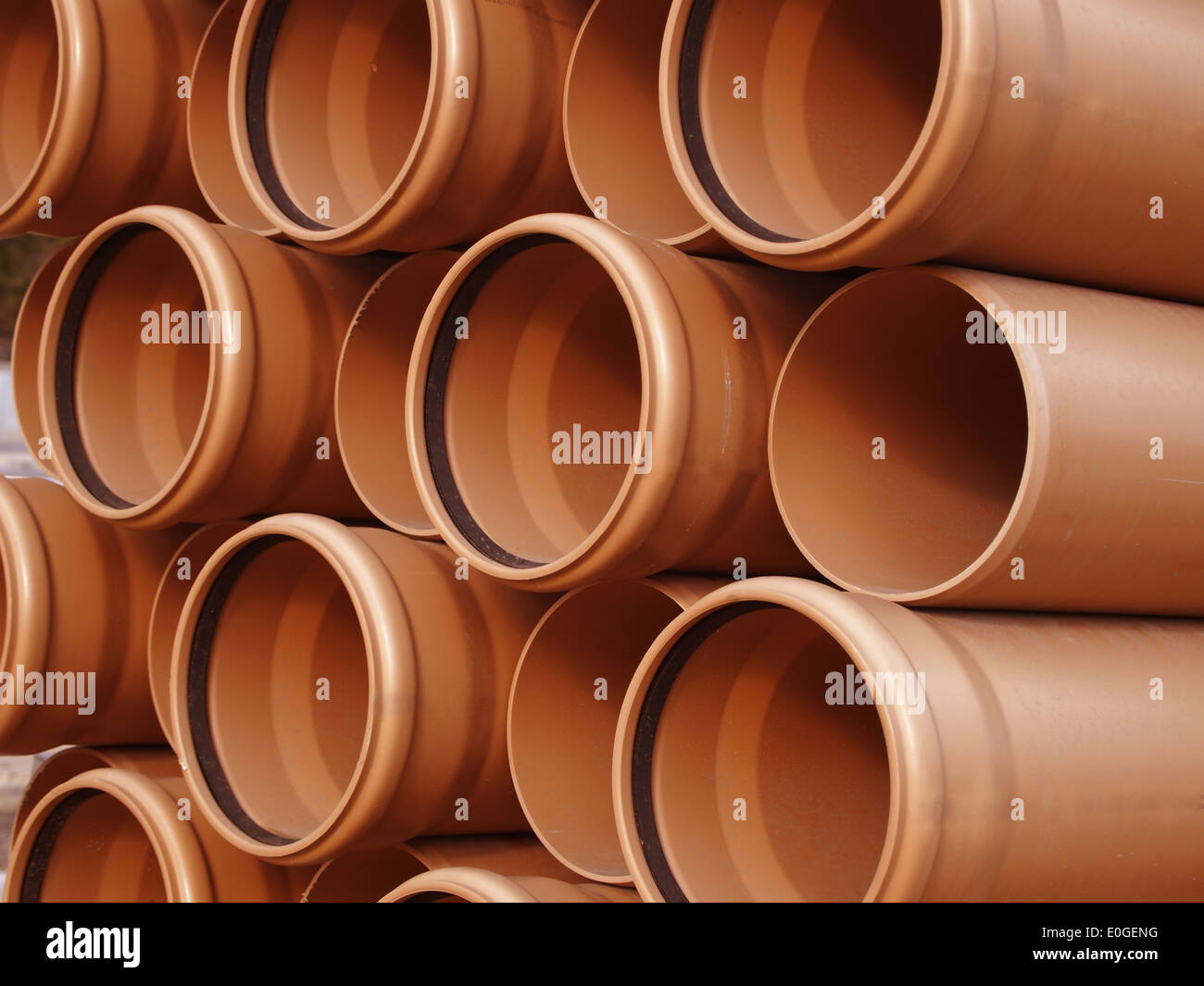 arranged on heap plastic pipes Stock Photo - Alamy