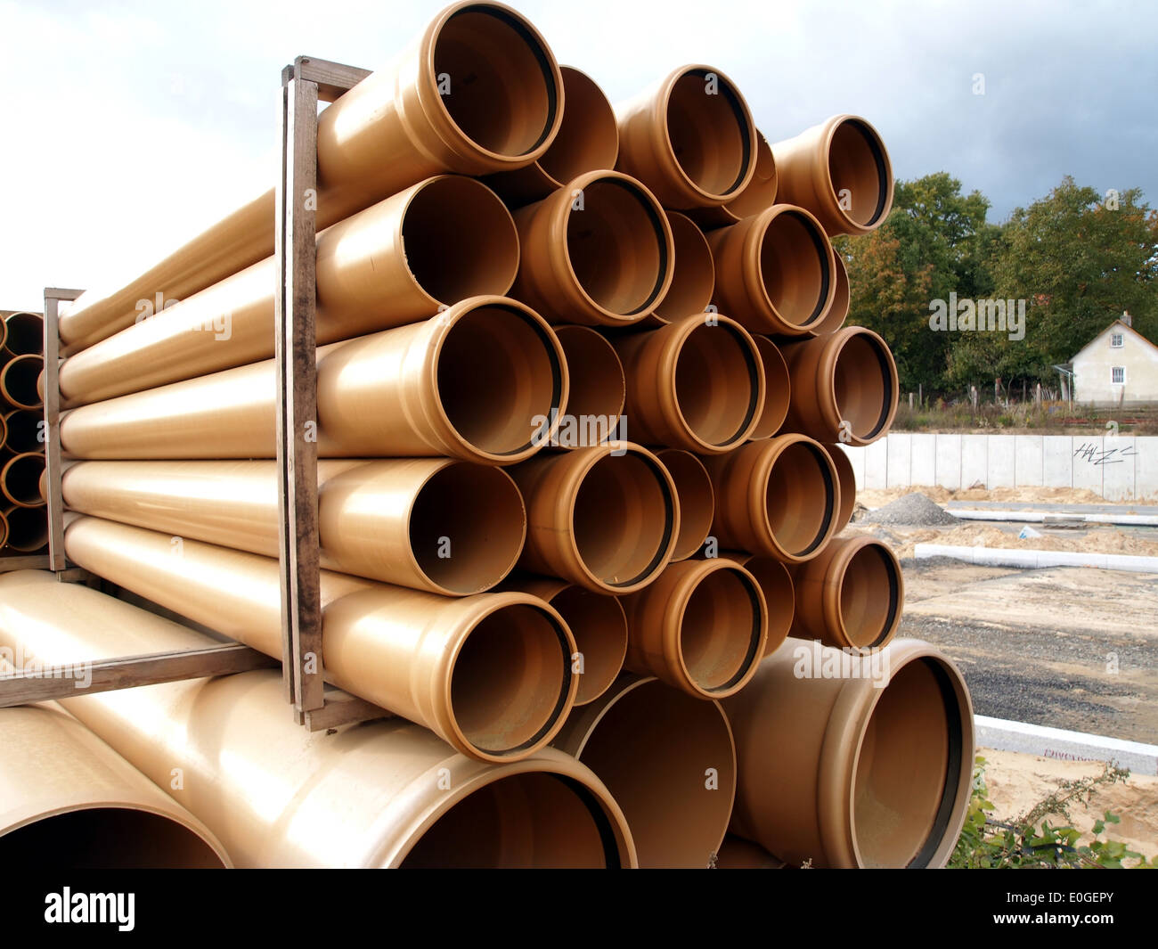 arranged on heap plastic pipes Stock Photo - Alamy