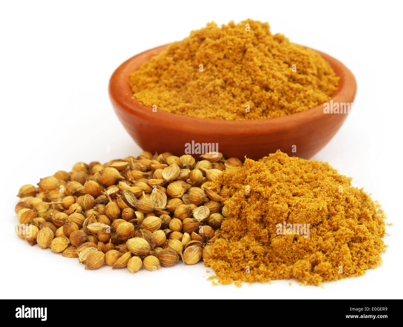 Whole and ground coriander over white background Stock Photo - Alamy