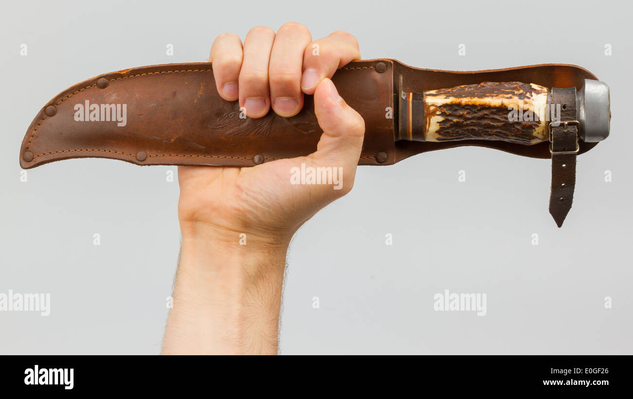 Old bond handle knife in leather casing on a white back ground Stock ...