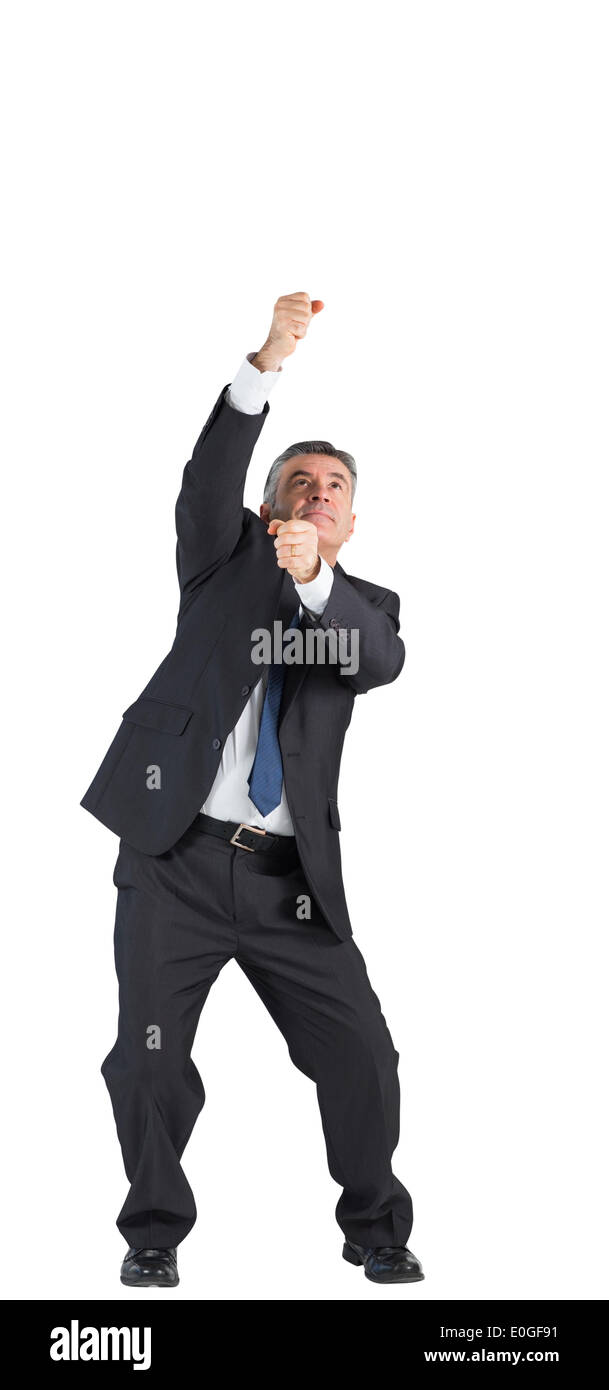 Mature businessman pulling with hands Stock Photo - Alamy