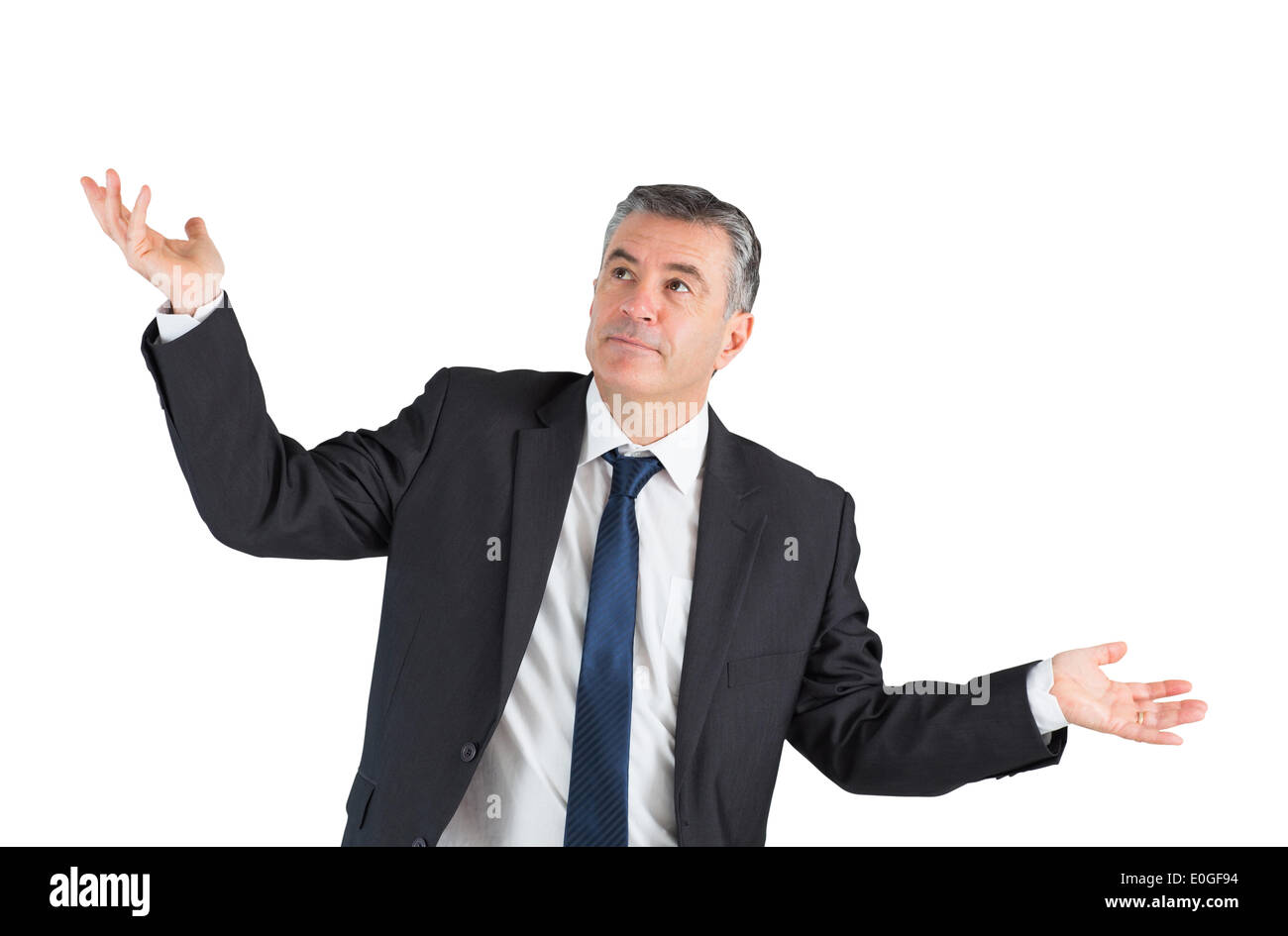 Mature businessman standing with arms out Stock Photo - Alamy
