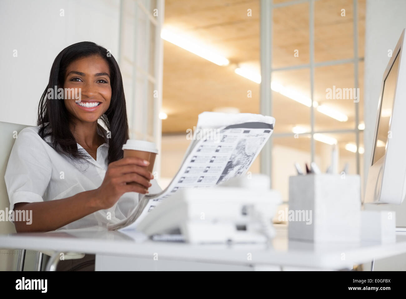 Looking at newspaper desk hi-res stock photography and images - Alamy