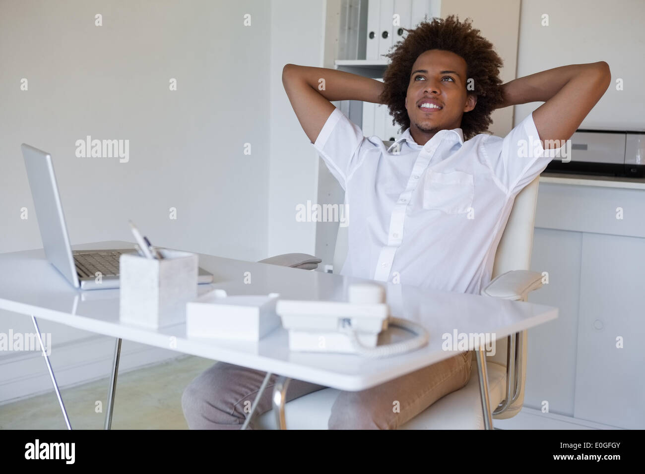 Man desk leaning back hands hi-res stock photography and images - Alamy