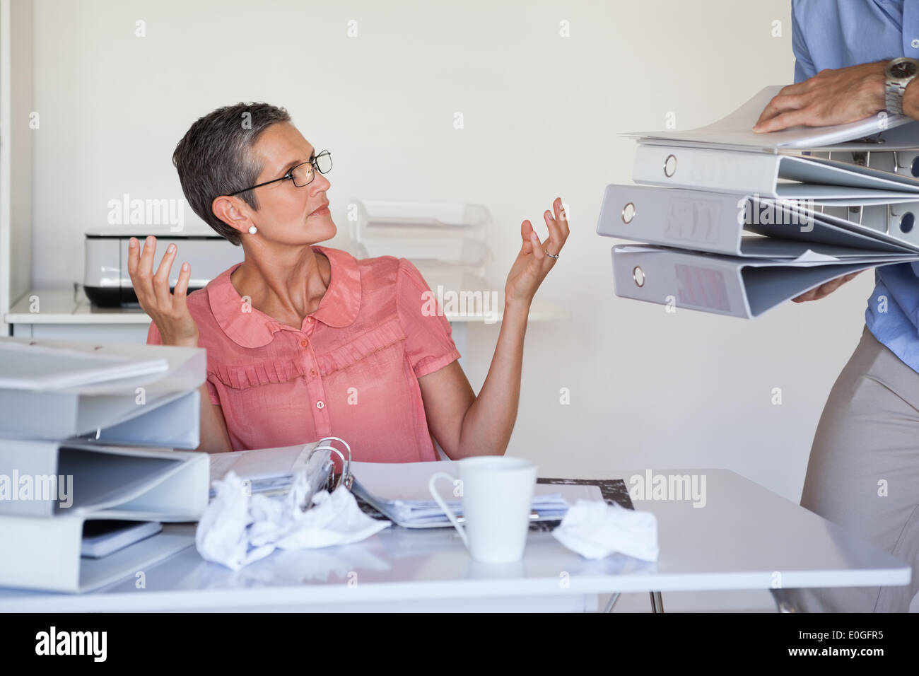 Casual businesswomans workload getting bigger and bigger Stock Photo ...