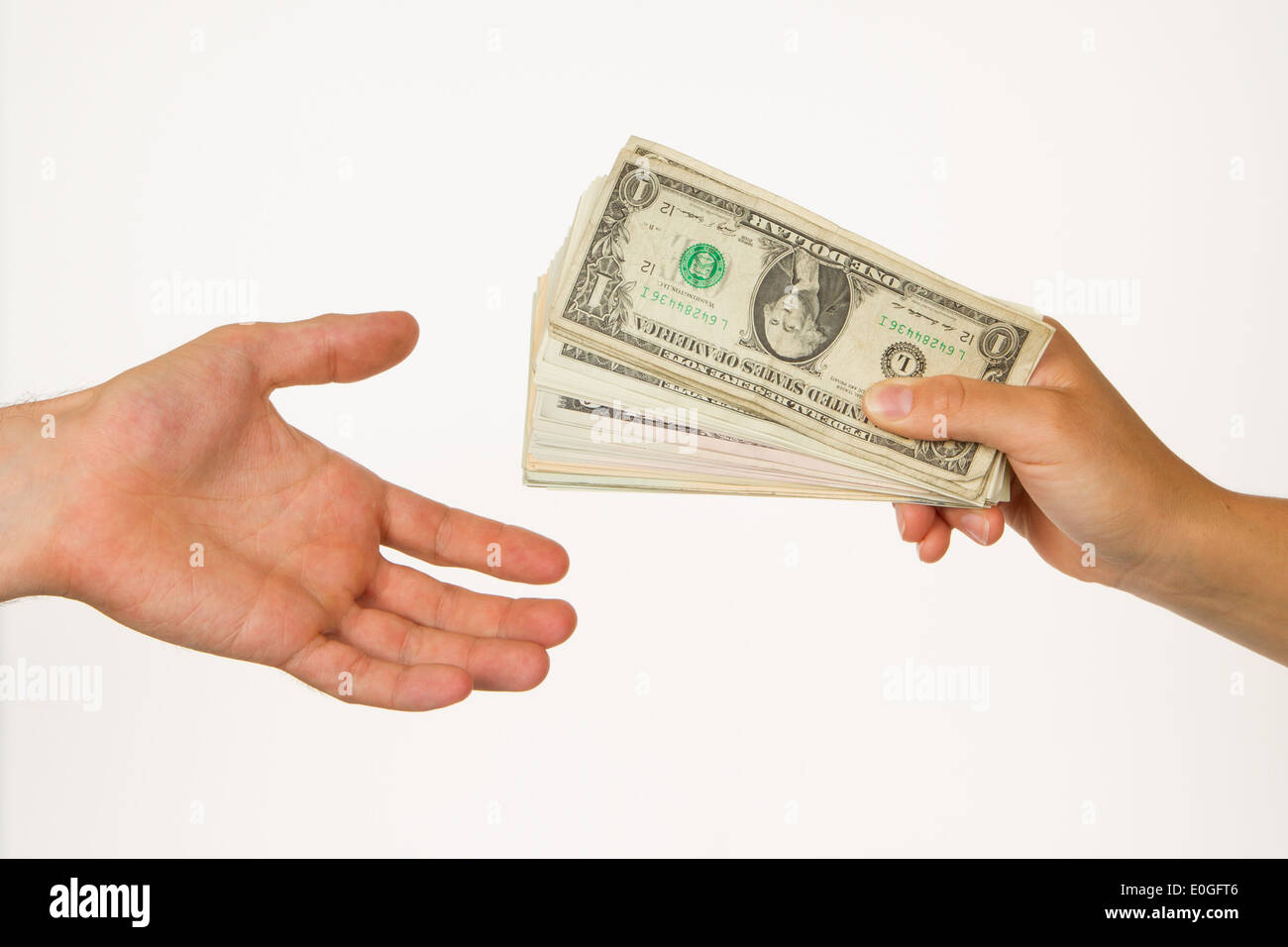Transfer of money between man and woman, isolated on white Stock Photo ...