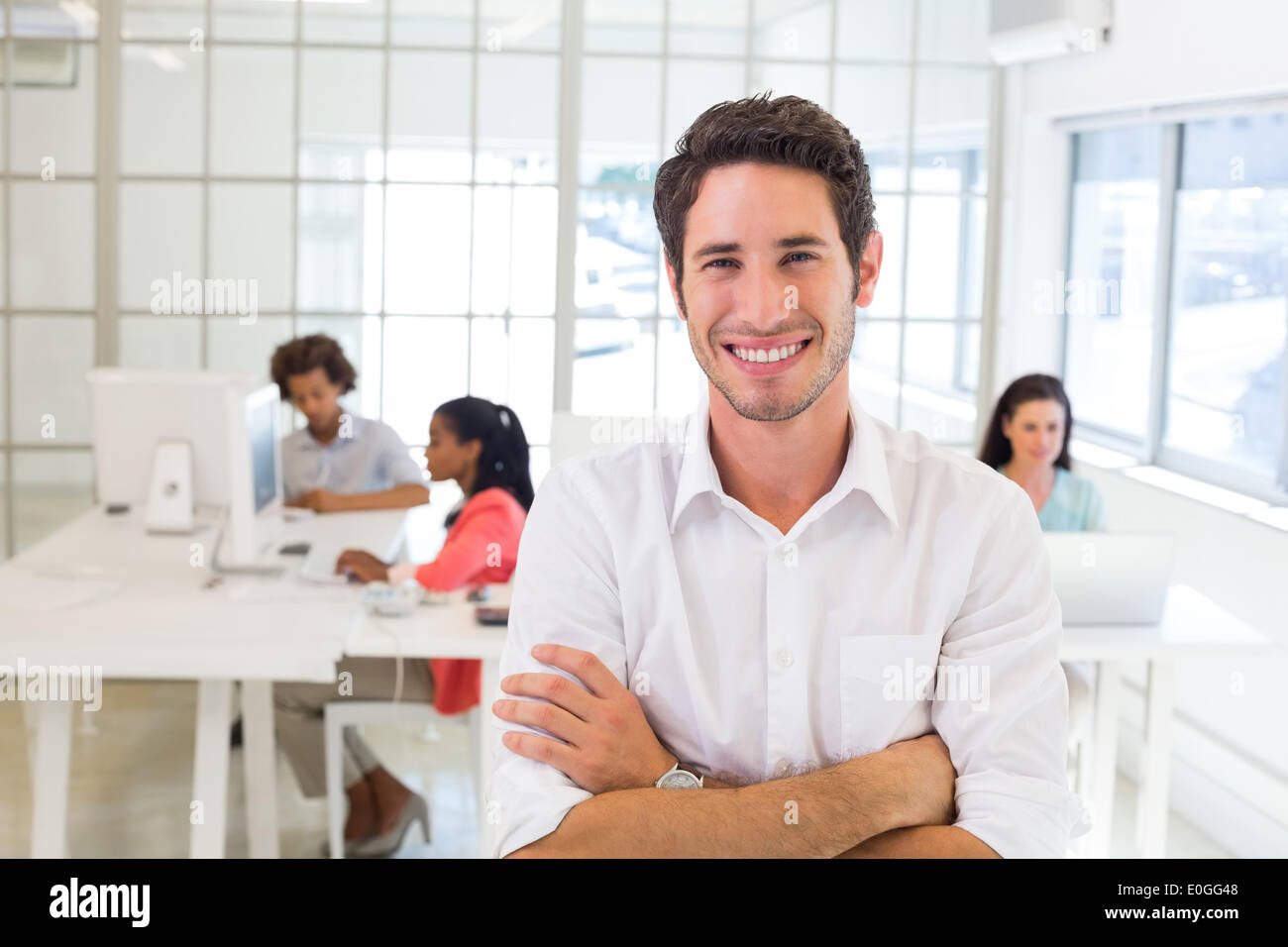 Cheerful business man at work Stock Photo - Alamy