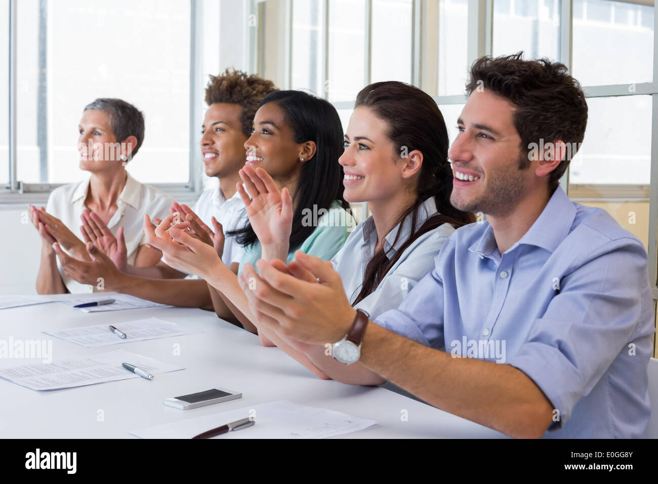 Business people clapping after presentation Stock Photo - Alamy