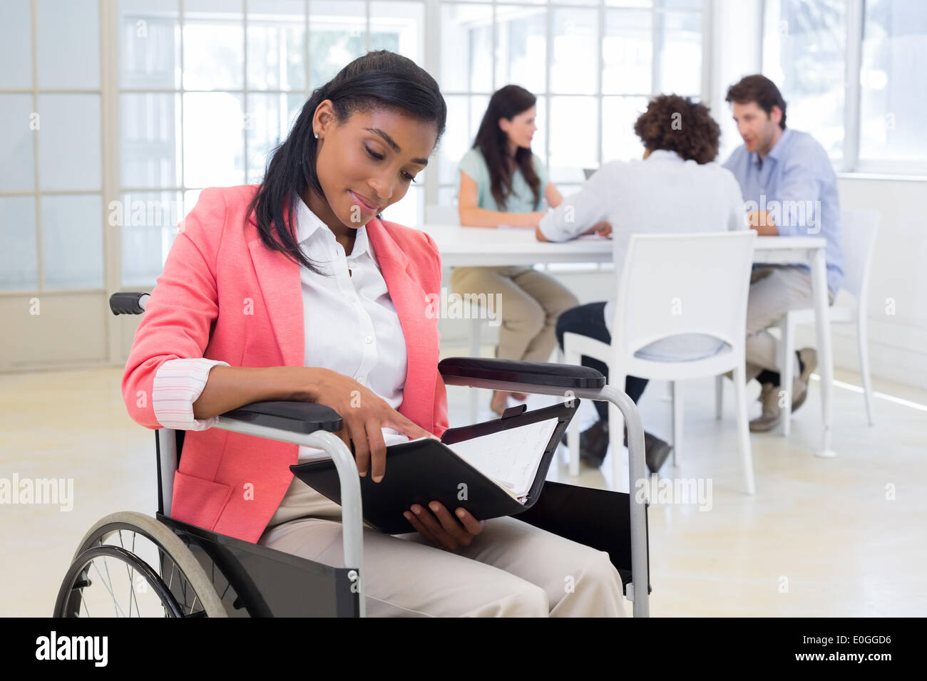 Disabled woman in wheelchair reading hi-res stock photography and ...