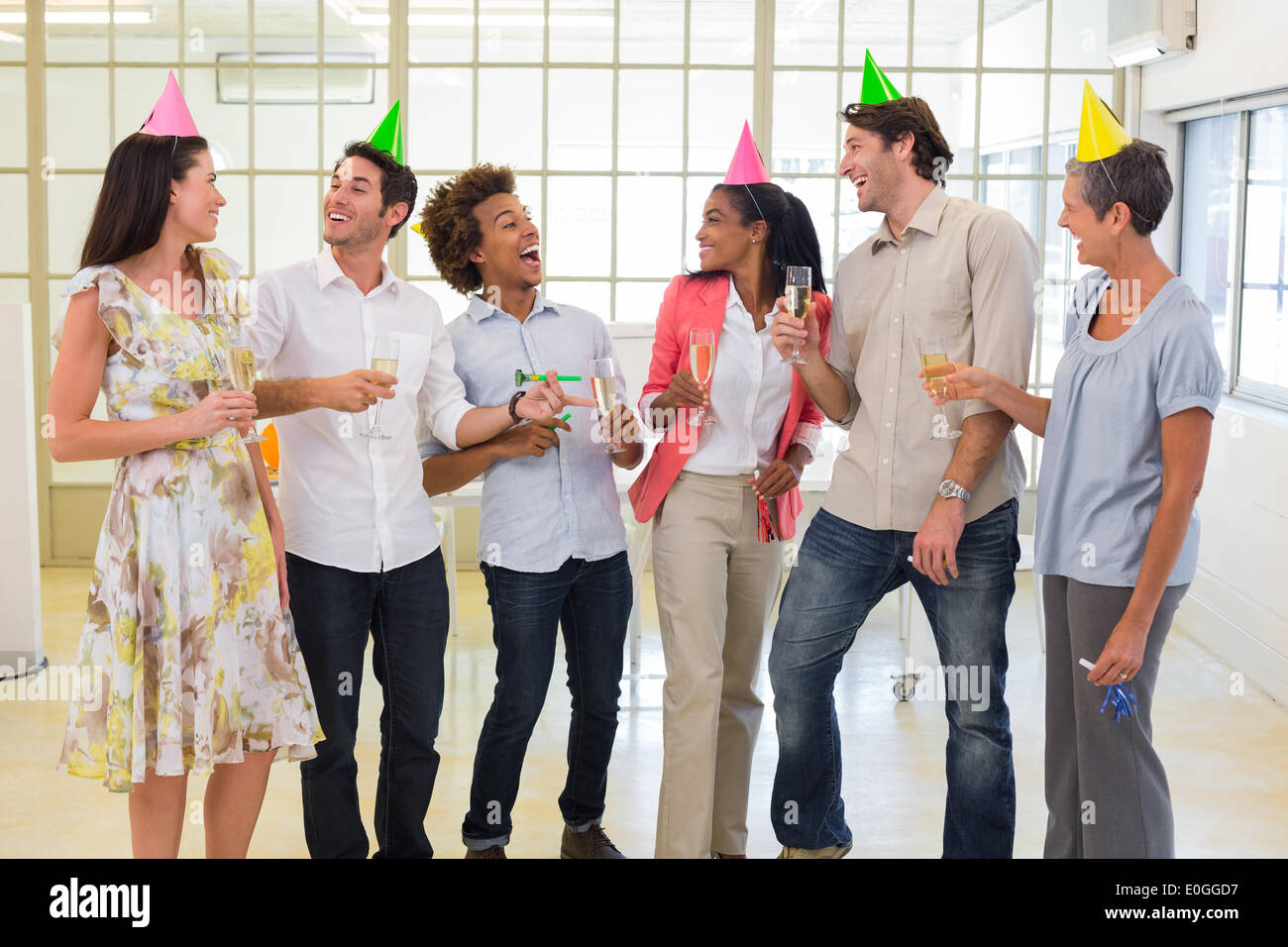 Coworkers laugh and celebrate accomplishment and enjoy party Stock ...