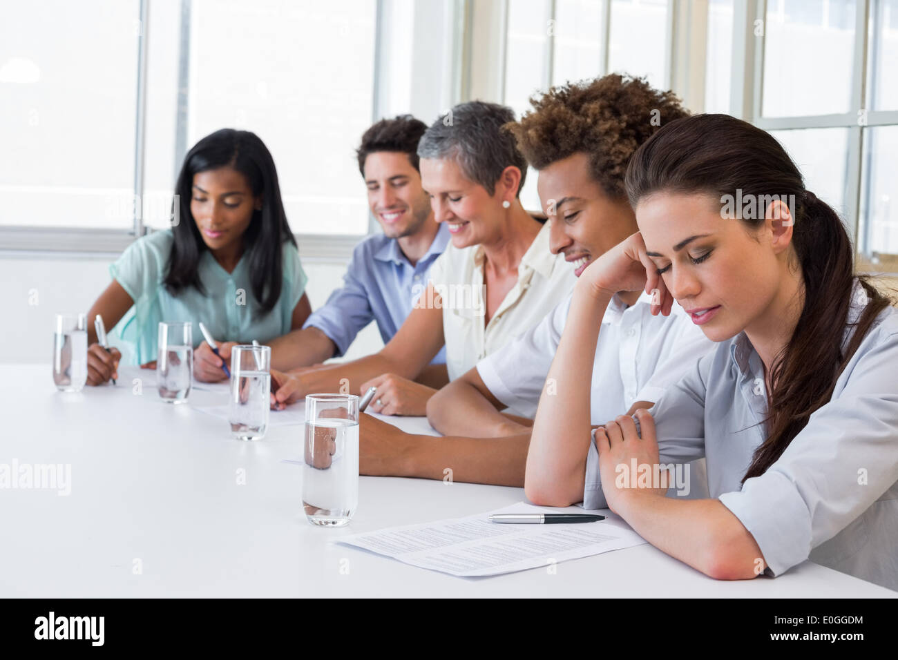 Business people writing in notebooks Stock Photo - Alamy