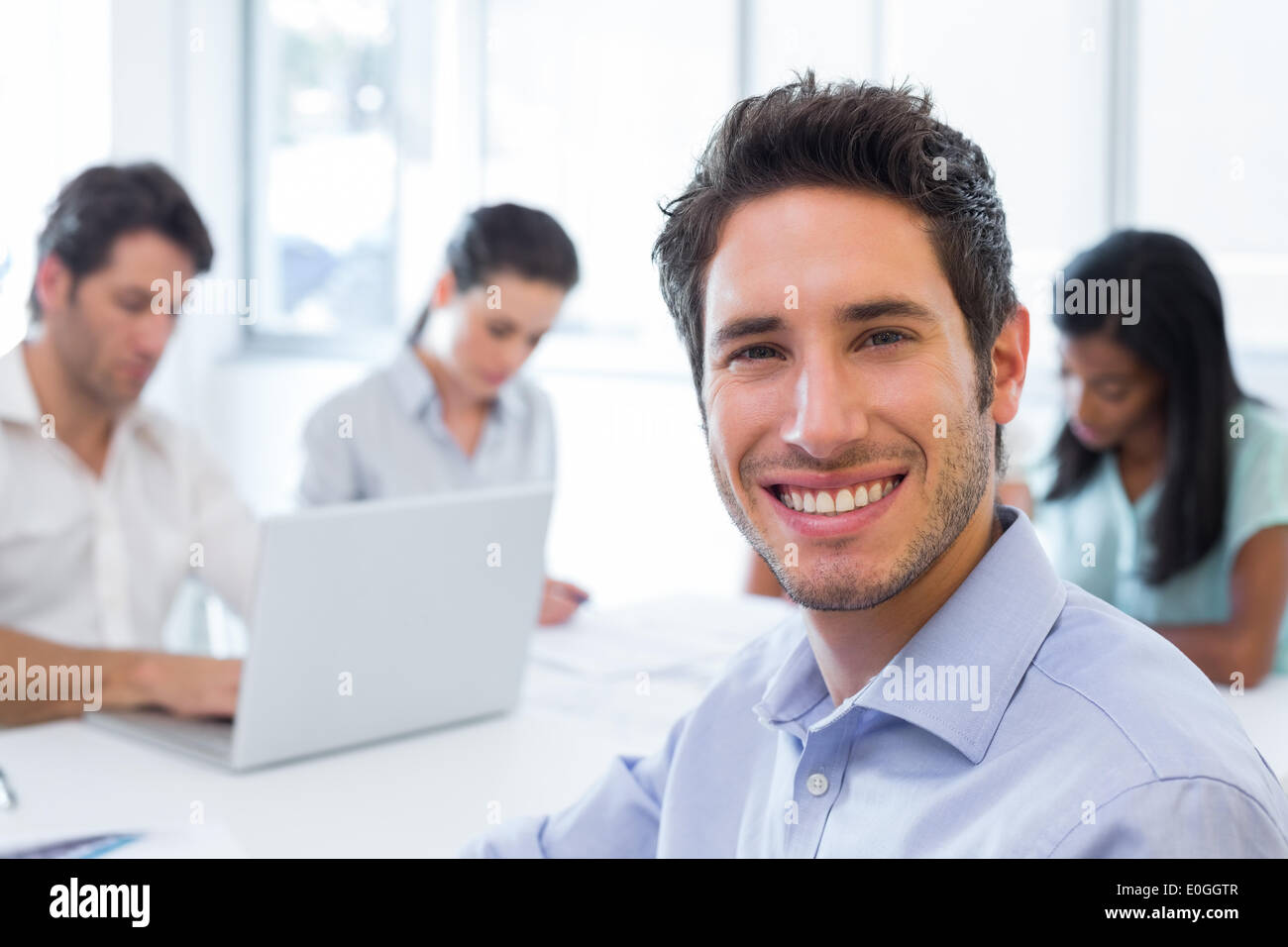 Smiling in the workplace hi-res stock photography and images - Alamy