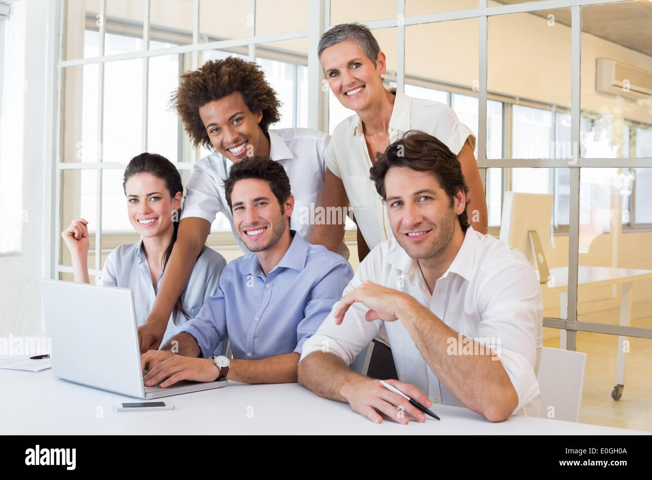 Business people using laptop smile to camera Stock Photo - Alamy