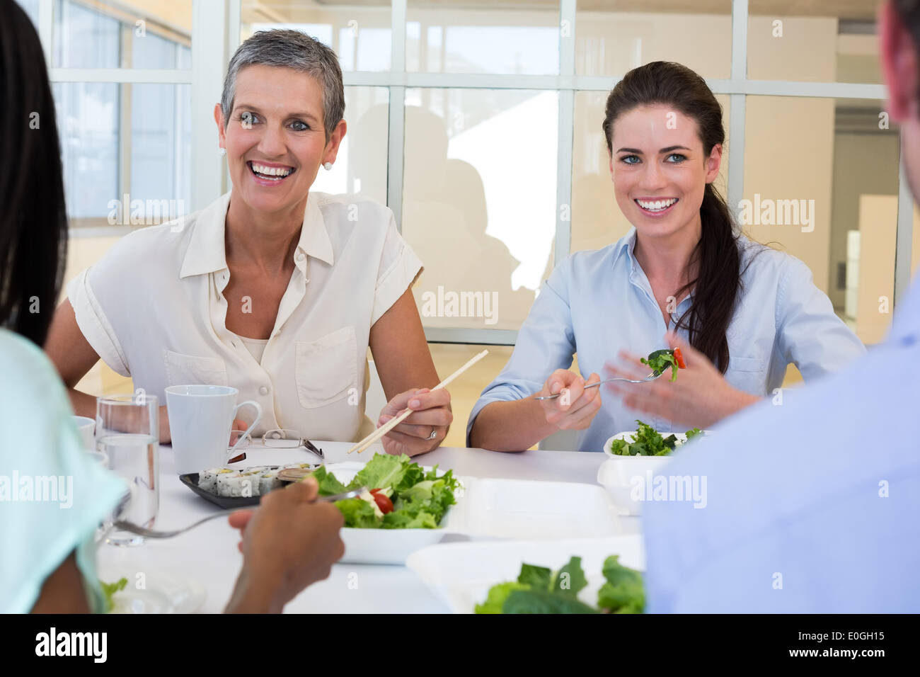 Business people enjoy healthy lunch Stock Photo - Alamy