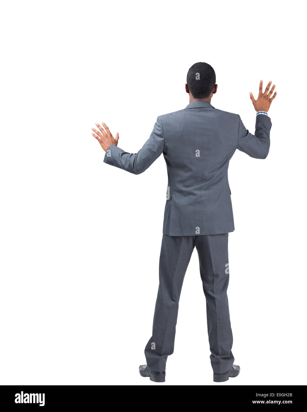Businessman standing with hands up Stock Photo - Alamy