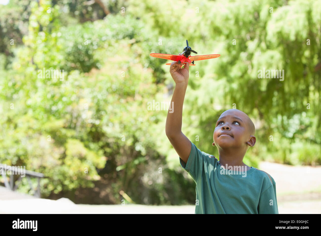 Happy little boy flying toy airplane Stock Photo - Alamy